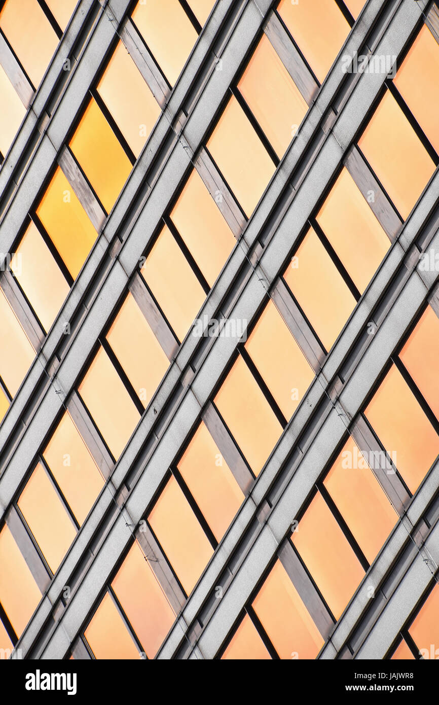 Orange colored glass windows of modern business office building at ...