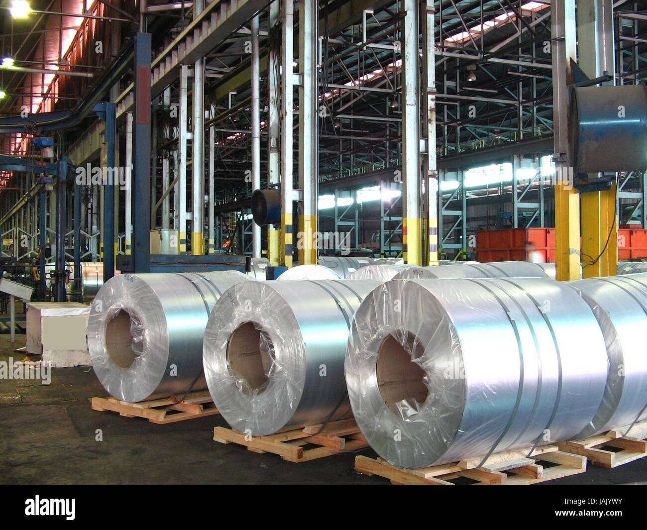 Rolled aluminum coils on industrial warehouse Stock Photo - Alamy