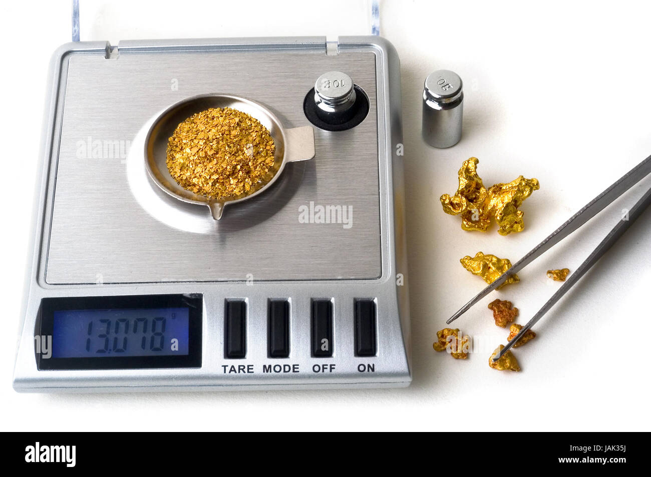 Weighing of gold Stock Photo - Alamy