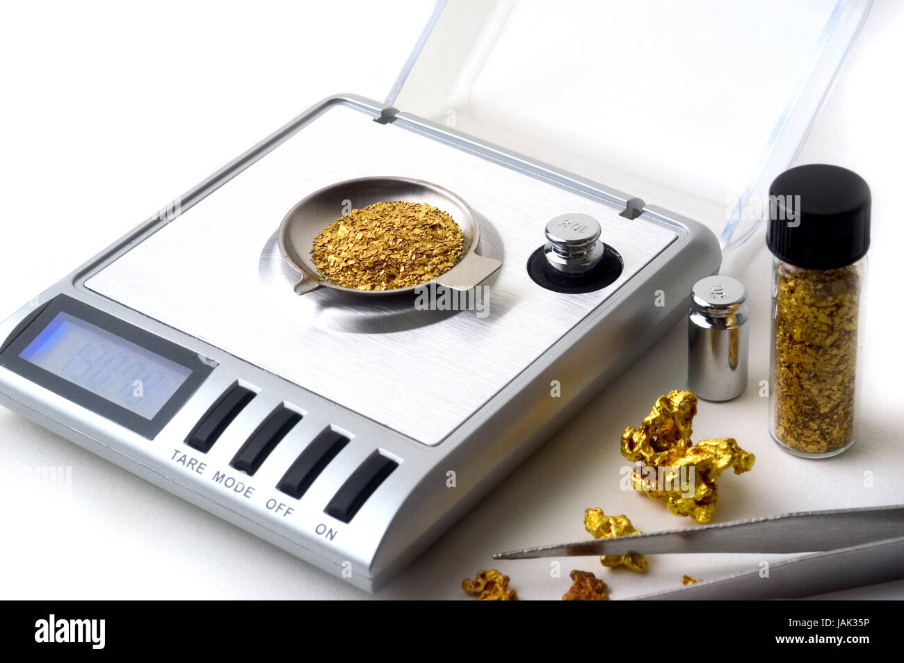 Weighing of gold Stock Photo - Alamy