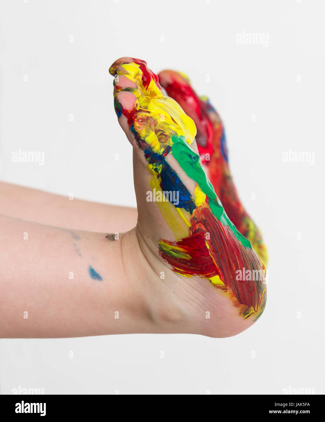 painted feet in light grey background. studio shot Stock Photo - Alamy