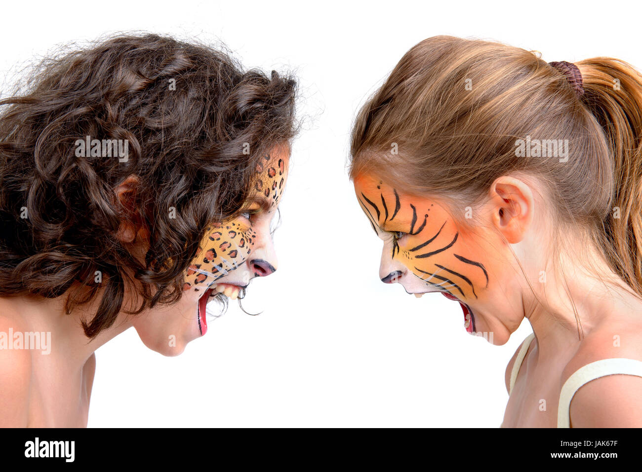 Beautiful young girls with feline painted faces, tiger and leopard ...