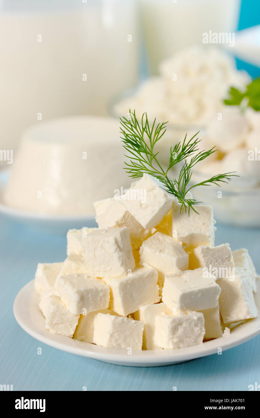 Feta cheese cut into slices on a plate Stock Photo - Alamy