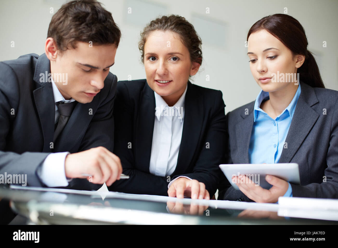Portrait of smart business partners working together in office Stock ...