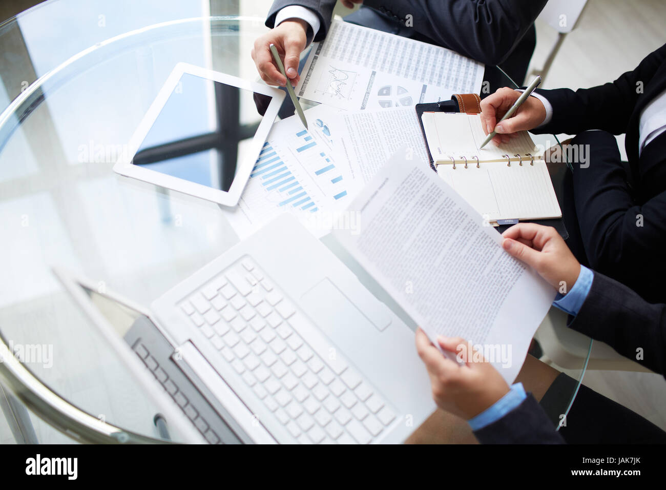 Image of human hands during paperwork at meeting Stock Photo - Alamy