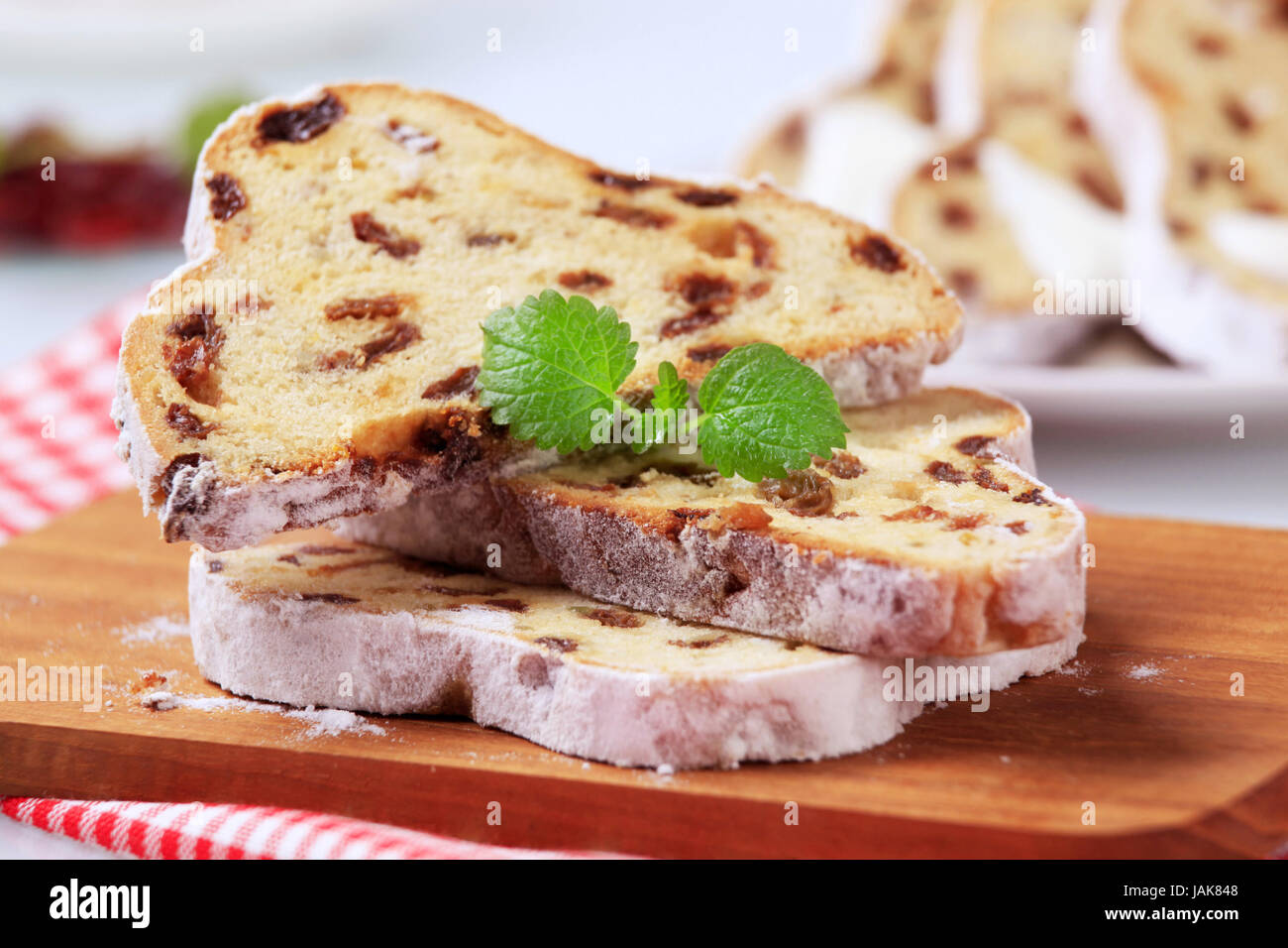 Slices of a stollen powdered with icing sugar Stock Photo - Alamy