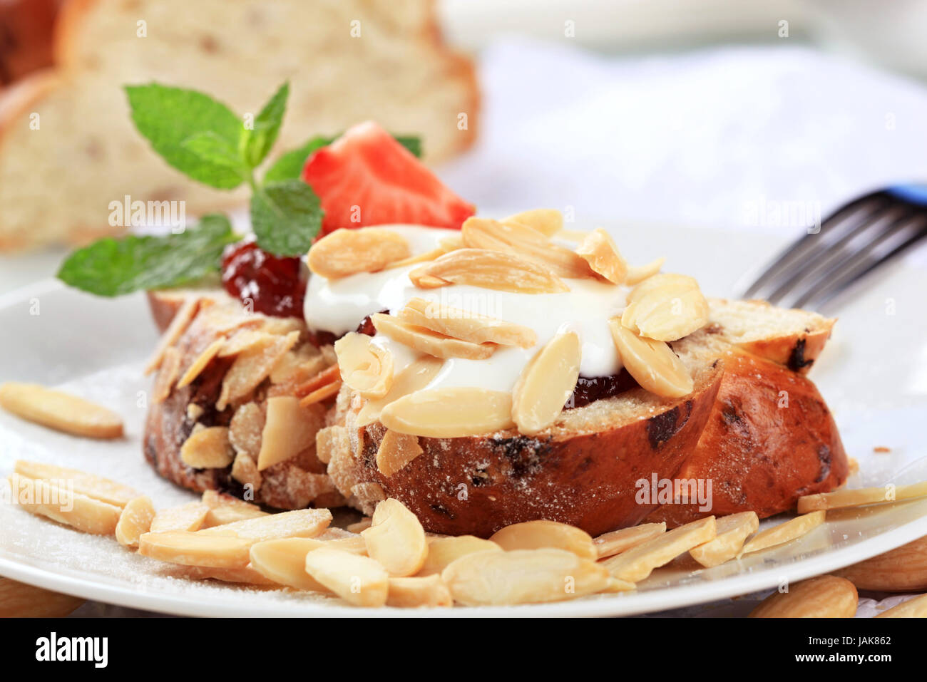 Slice of sweet bread with jam and cream cheese Stock Photo - Alamy