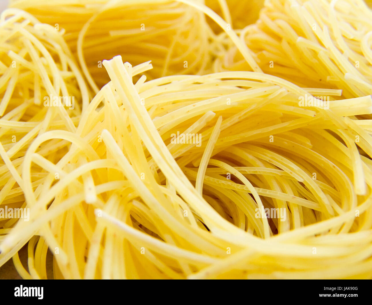 food background a pile of beautiful spaghetti nests Stock Photo - Alamy