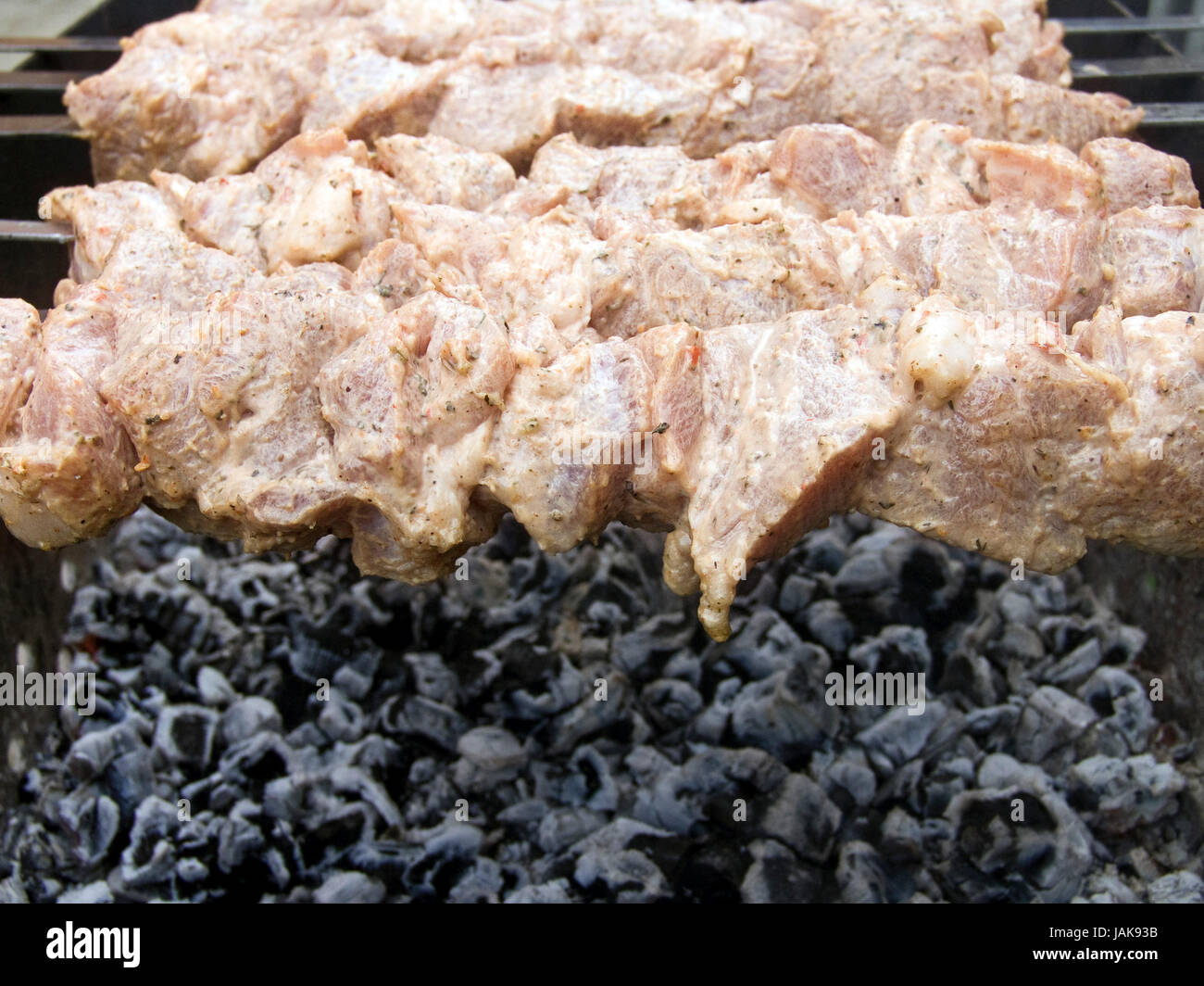 Process of preparation of a shish kebab, from uncooked to the cooked ...