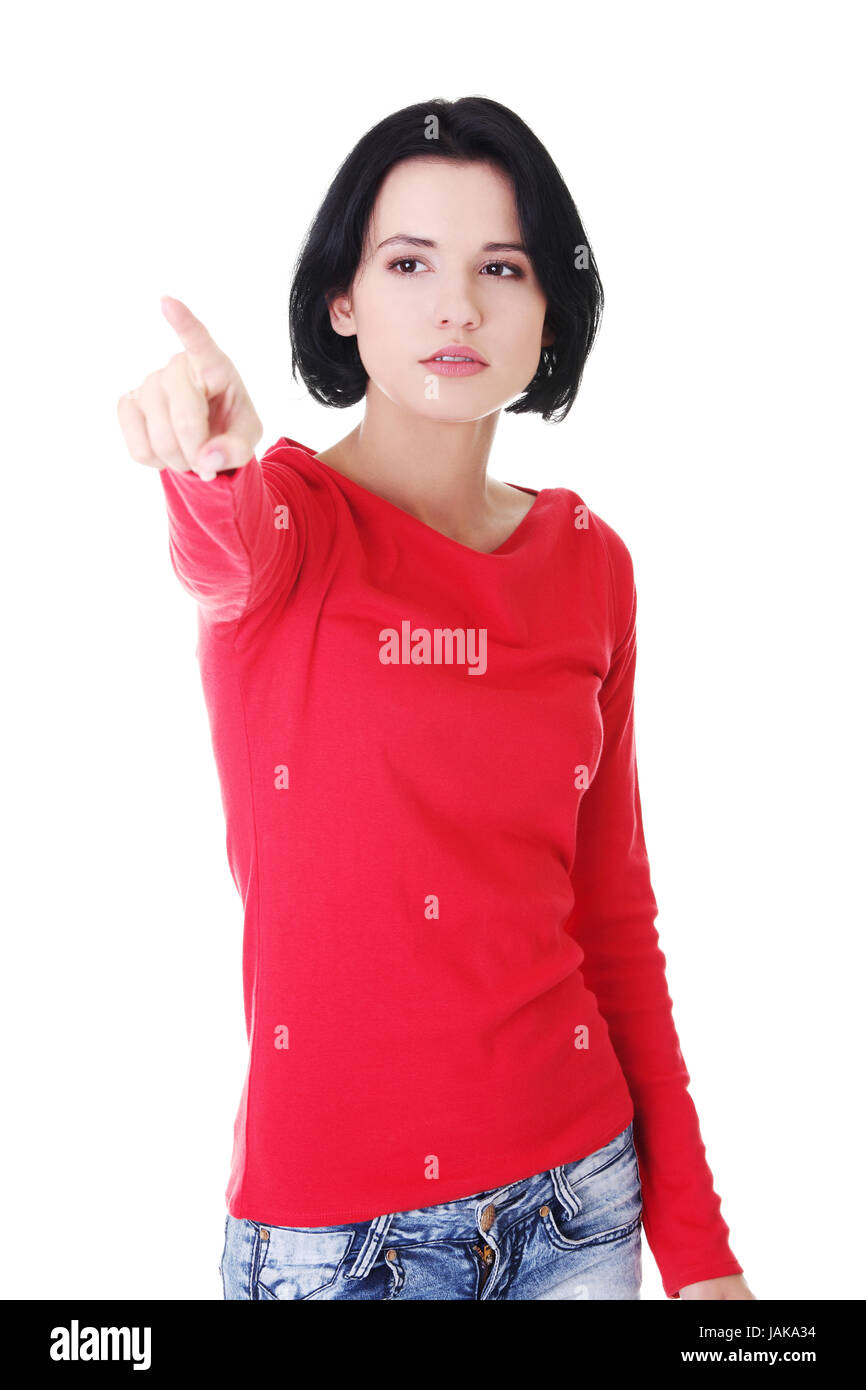 Attractive woman in red tshirt pointing up. Isolated on white Stock ...