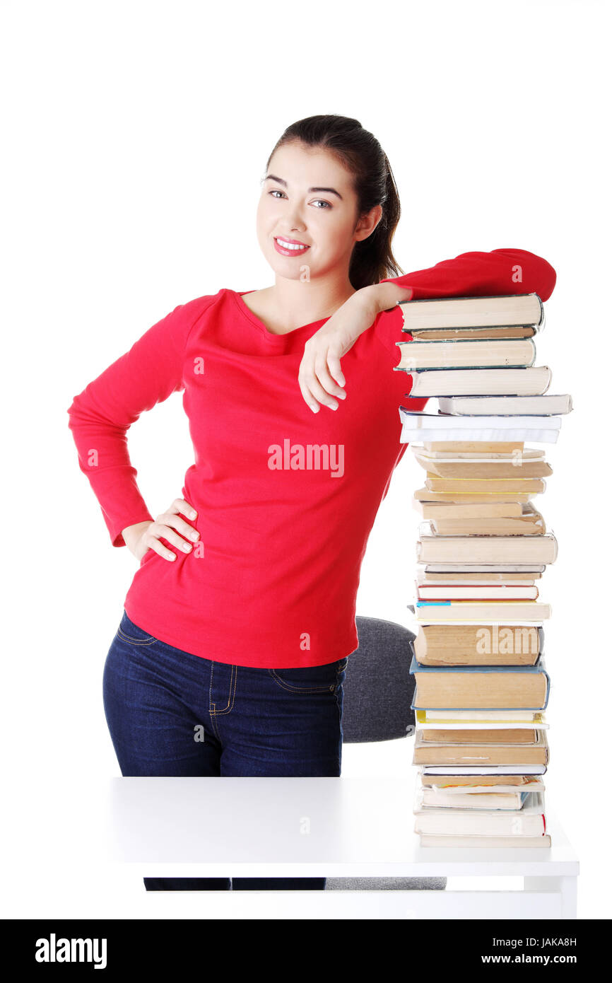 Girl book stack pile teenager Cut Out Stock Images & Pictures - Alamy