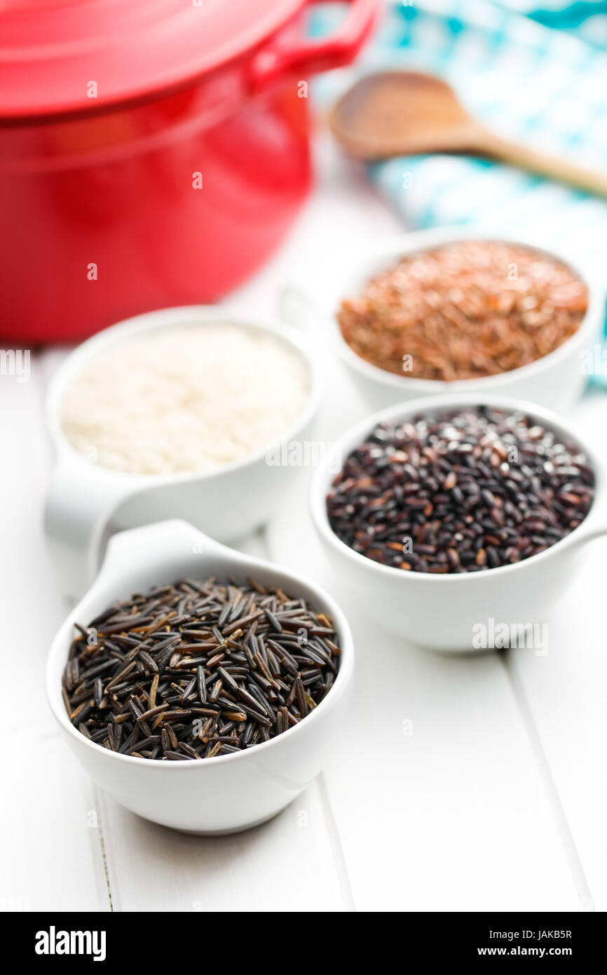 various rice in white ceramic bowls Stock Photo - Alamy