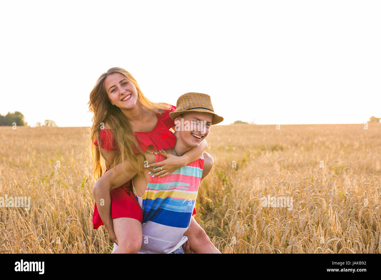 happy young loving couple having fun outdoor in summertime Stock Photo ...