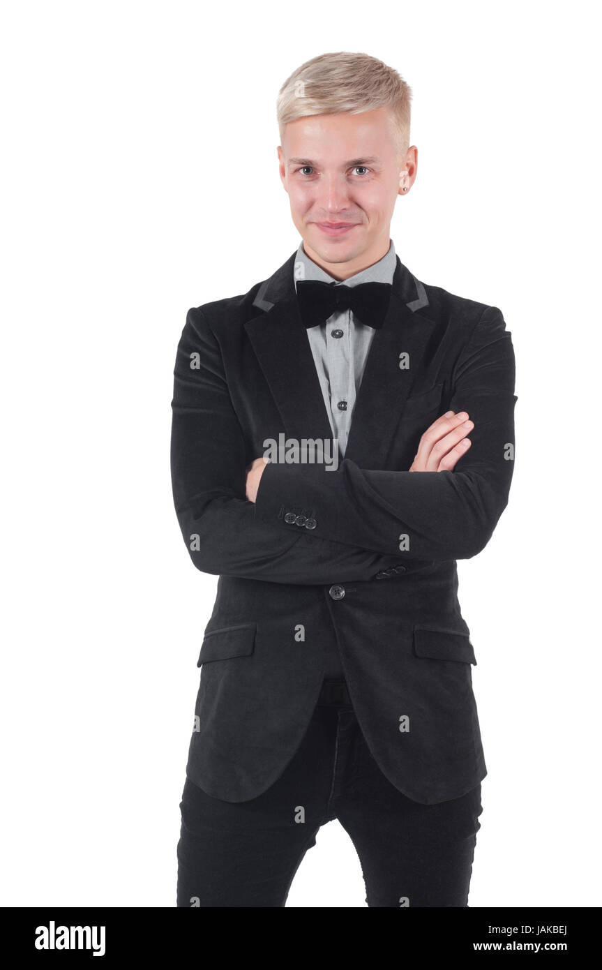 Man in jacket and bow-tie standing with crossed arms Stock Photo - Alamy