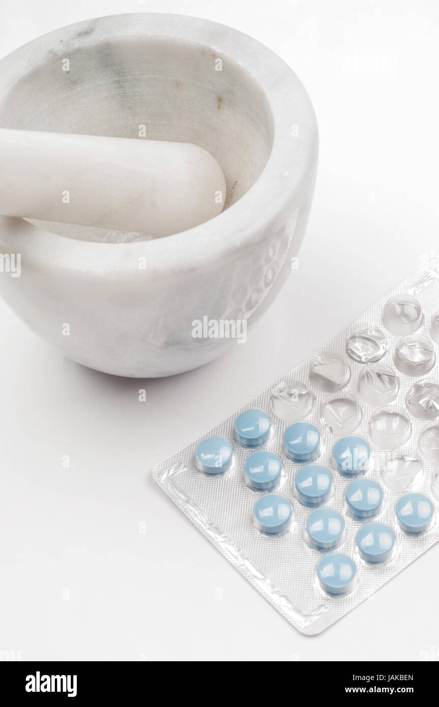 Shot of blue drugs (tablets) with marble mortar Stock Photo - Alamy