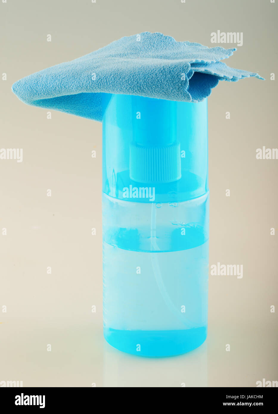 Lite blue detergent and cloth over white background Stock Photo - Alamy