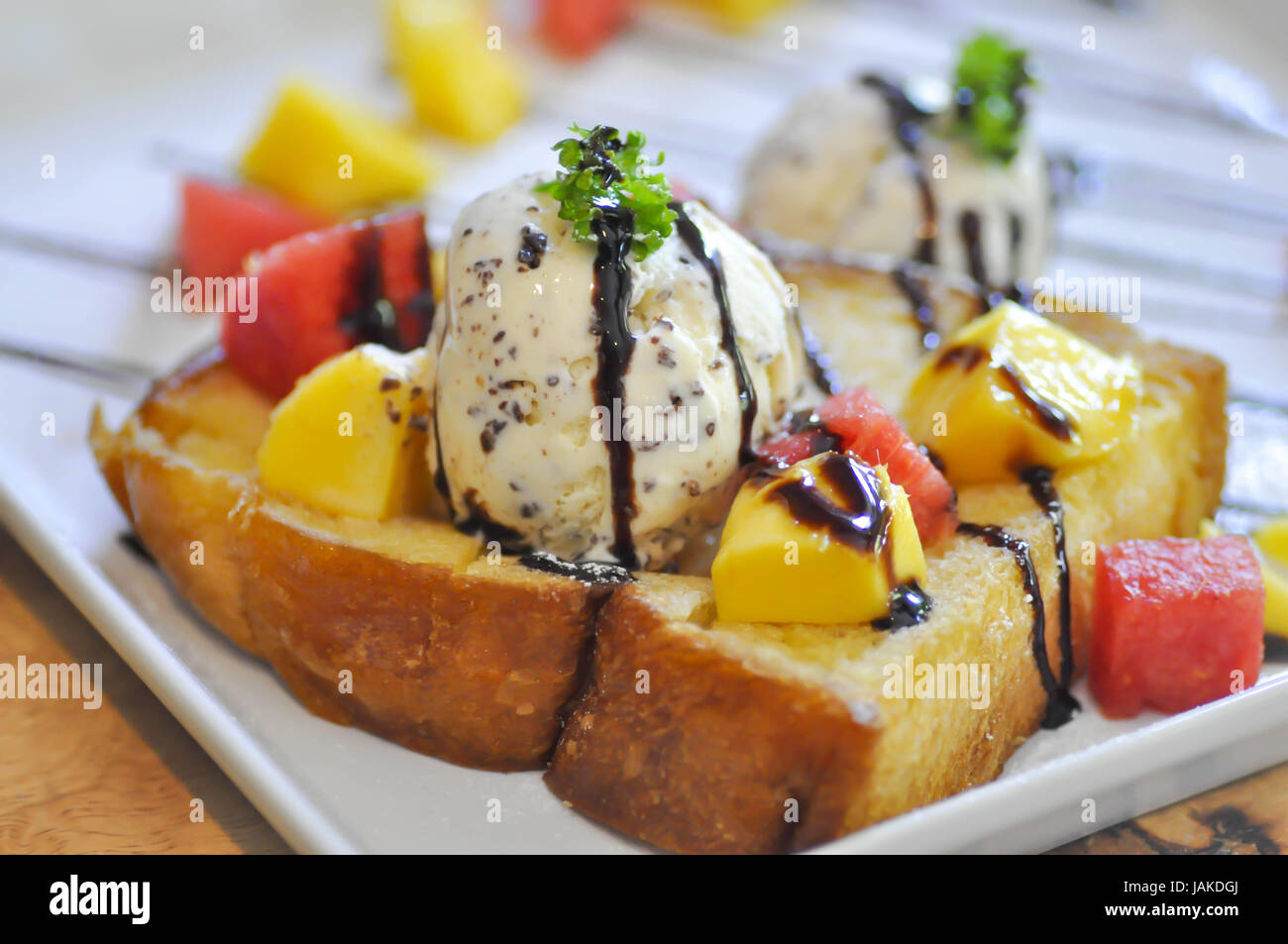 toast with ice cream and fruit topping dish Stock Photo - Alamy
