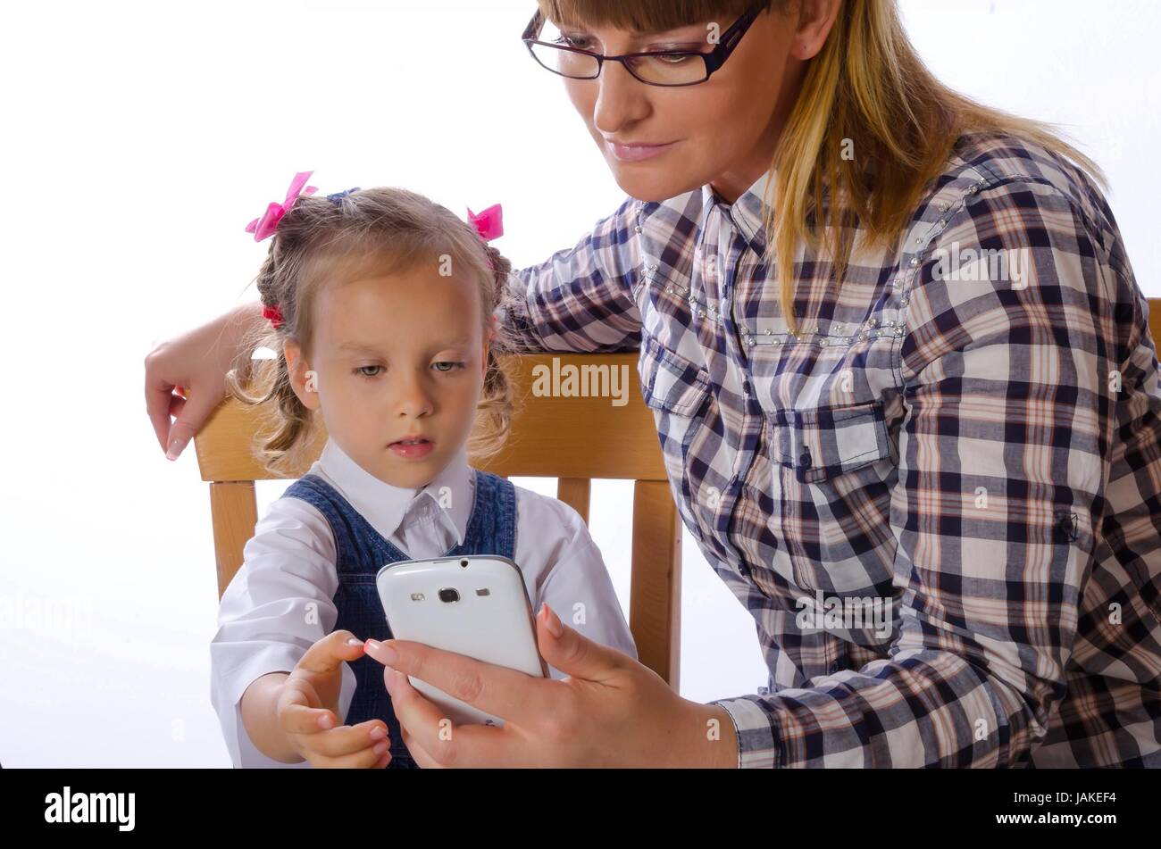 mother and daughter with mobile phone Stock Photo - Alamy
