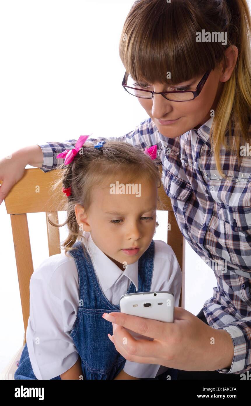 mother and daughter with mobile phone Stock Photo - Alamy