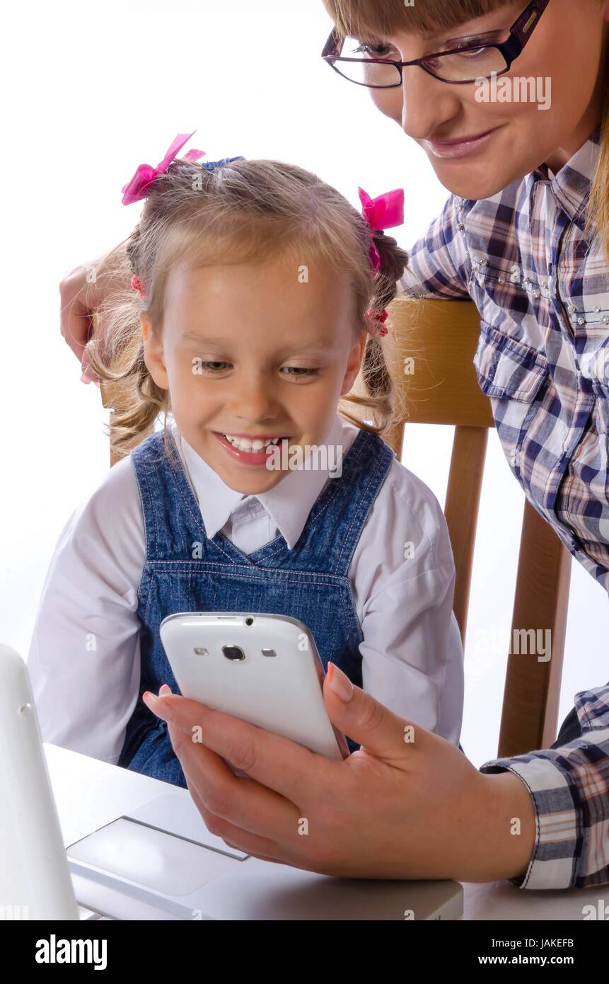 mother and daughter with mobile phone Stock Photo - Alamy