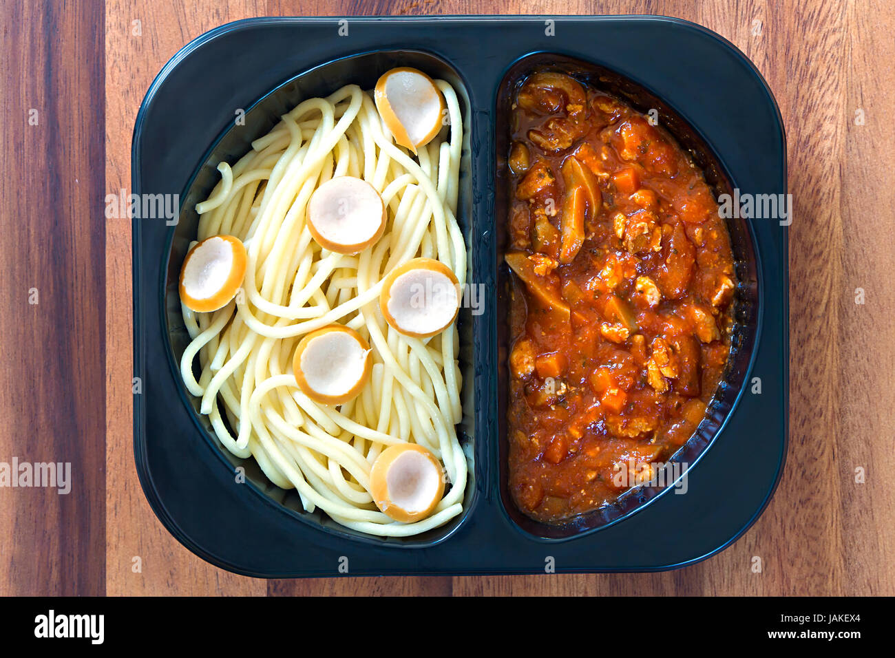 Spaghetti with red tomato sauce in a plastic box Stock Photo - Alamy
