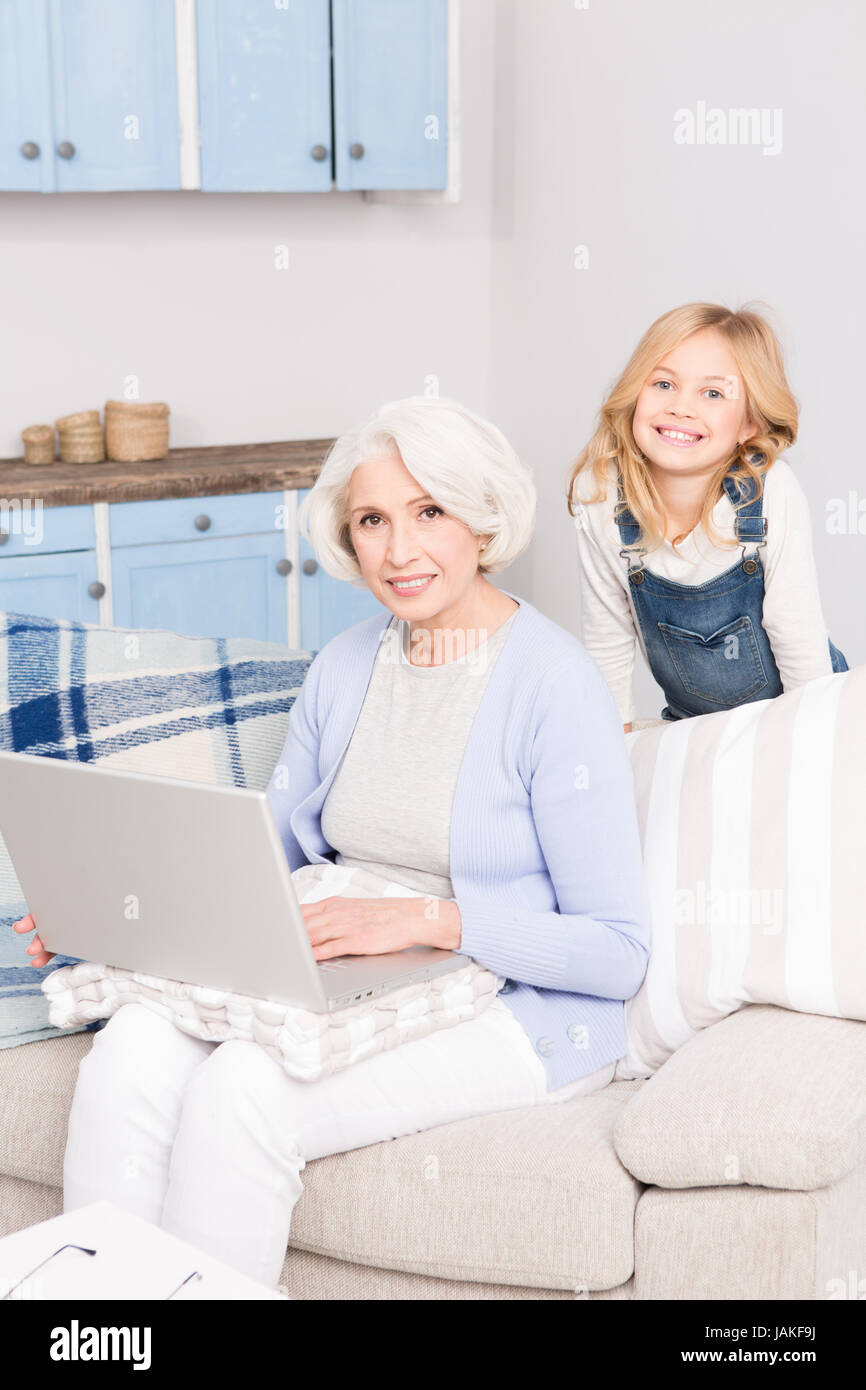 Granny and little girl using laptop Stock Photo - Alamy