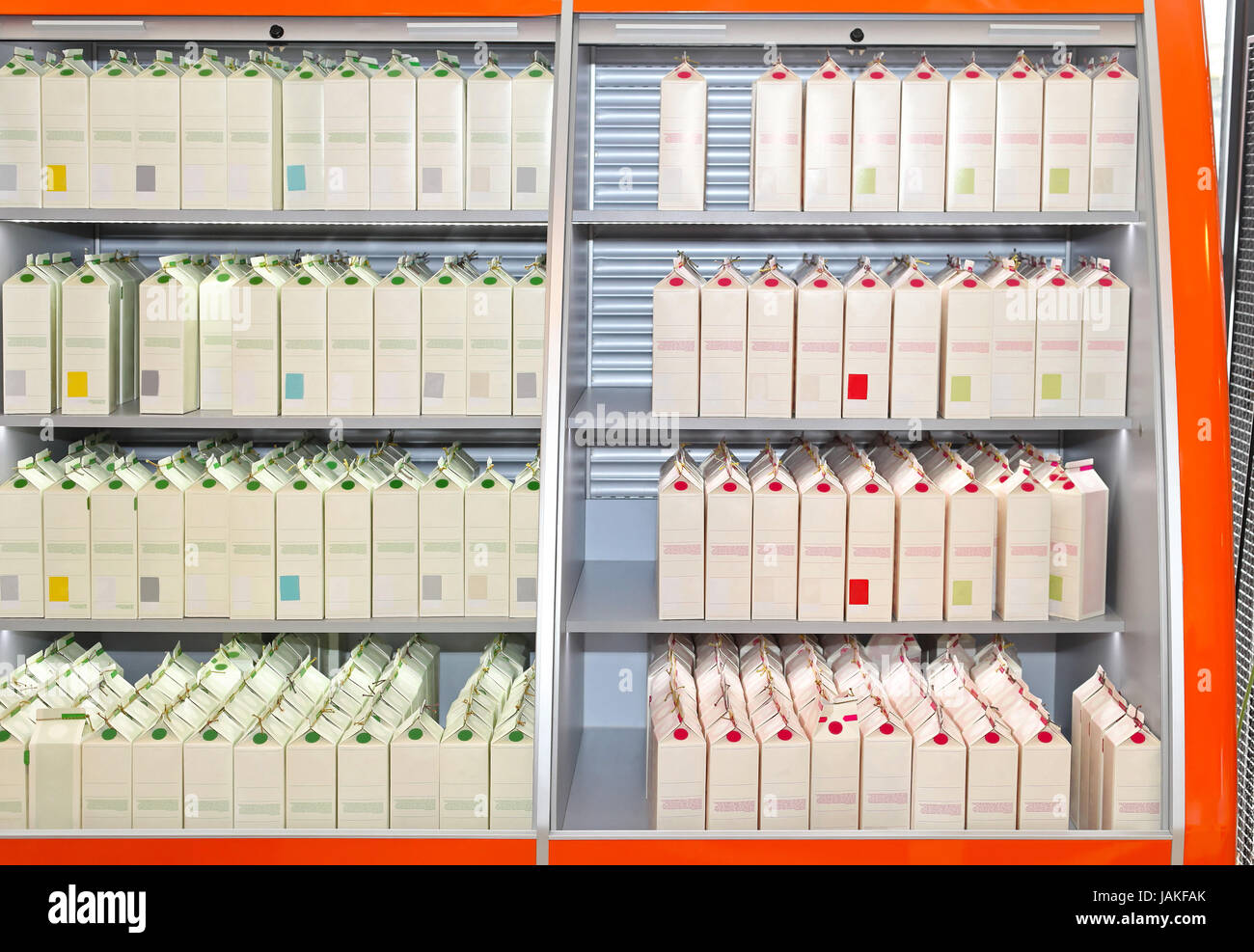 Milk in carton packaging at store shelf Stock Photo - Alamy