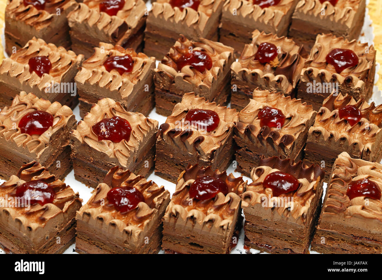 Brown chocolate cakes with jam topping Stock Photo - Alamy