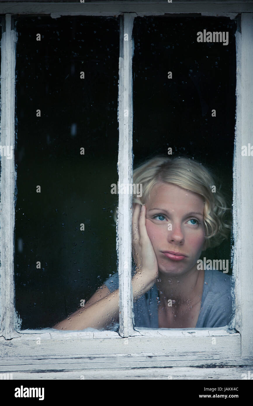 Woman out of window raining hi-res stock photography and images - Alamy