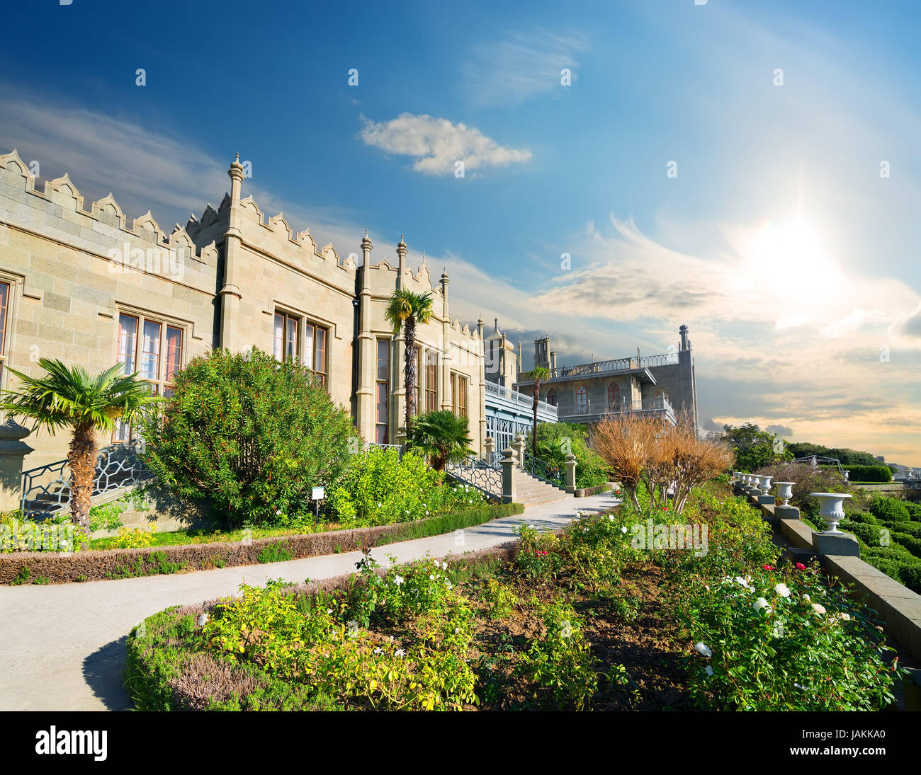Beautiful palace and green garden with flowers Stock Photo - Alamy
