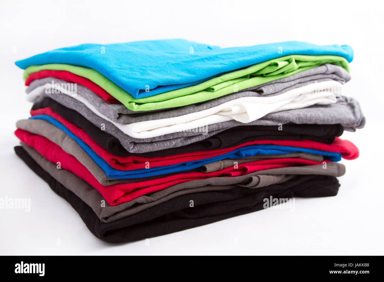 A pile of folded T shirts Stock Photo - Alamy