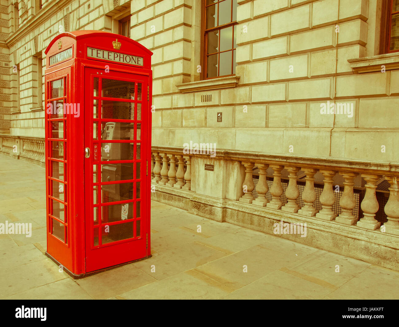 Vintage look Traditional red telephone box in London UK Stock Photo - Alamy