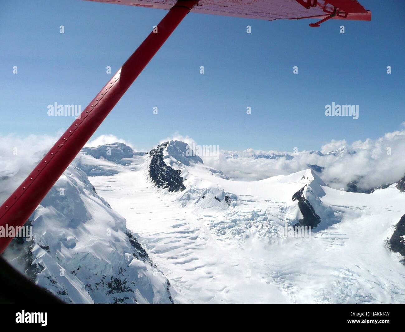 Aerial view of a rocky outcrop showing through a glacier Stock Photo ...