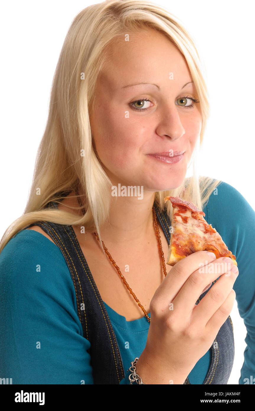 Junge Frau beim Essen vor weißem Hintergrund Stock Photo - Alamy