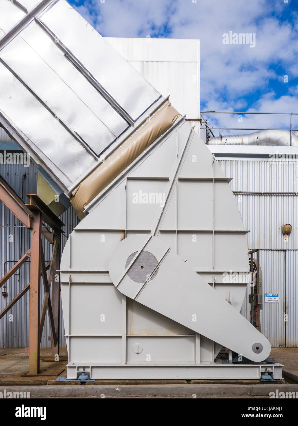 Large centrifugal fan outside an industrial processing plant Stock ...