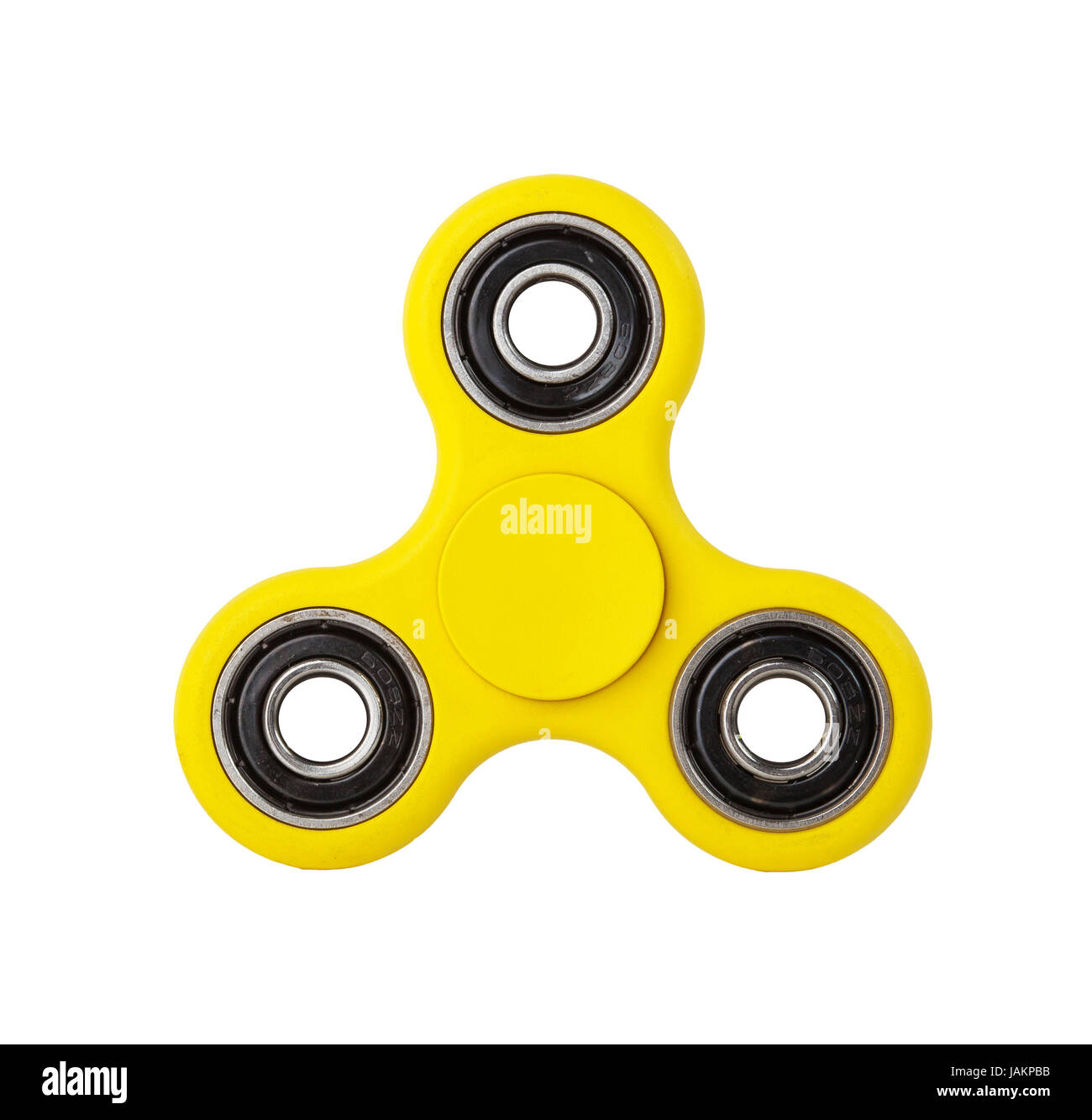 Yellow Fidget Spinner isolated on white background Stock Photo - Alamy