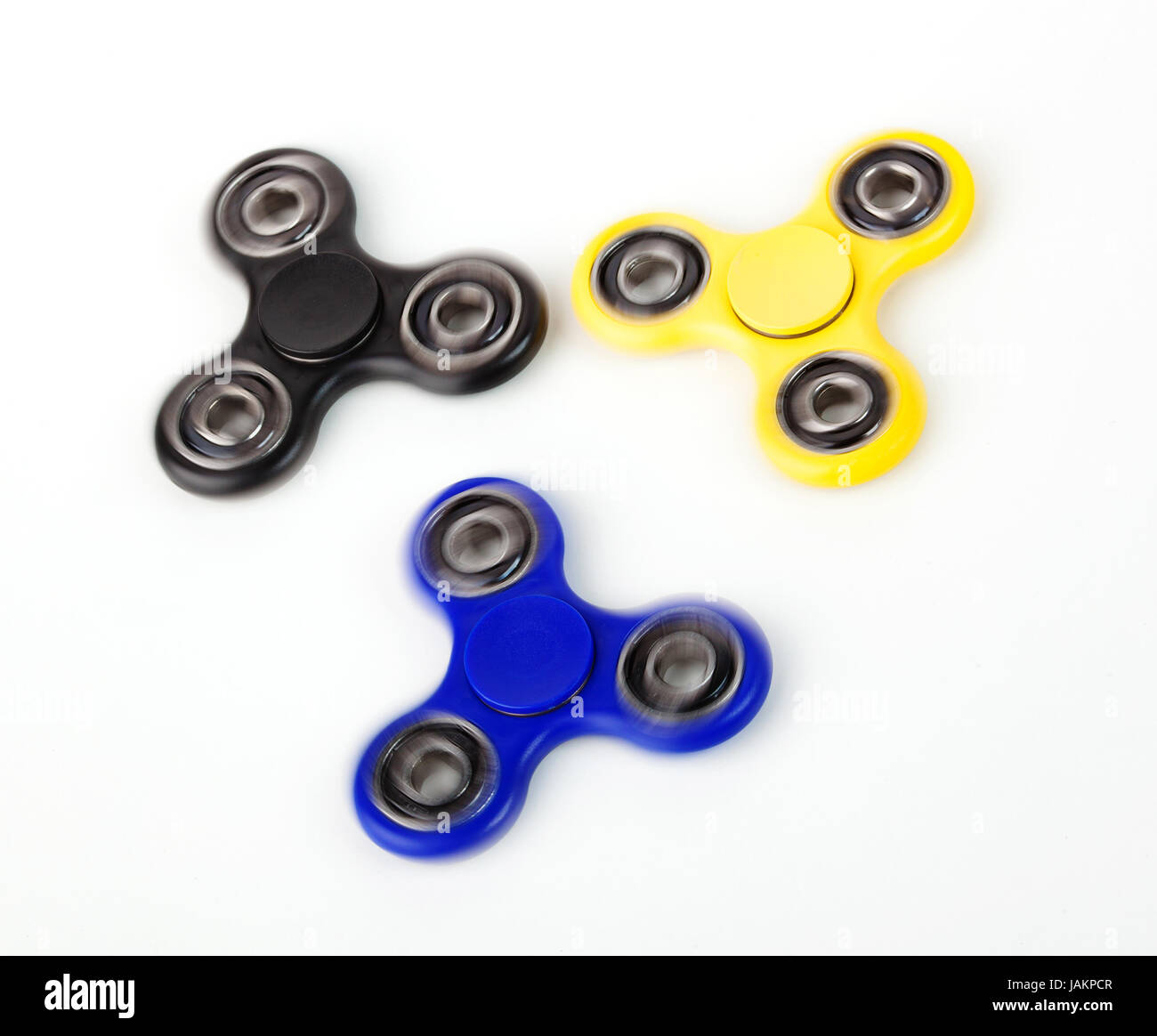 Three Fidget Spinner isolated on white background Stock Photo - Alamy