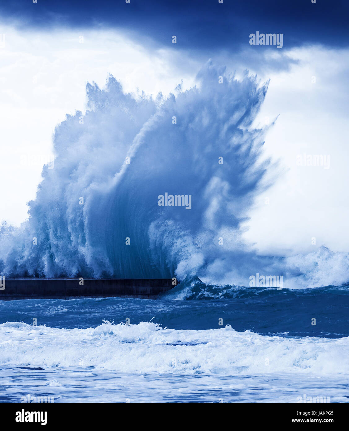 Giant wave splash, big powerful tide in action, storm weather in a deep ...