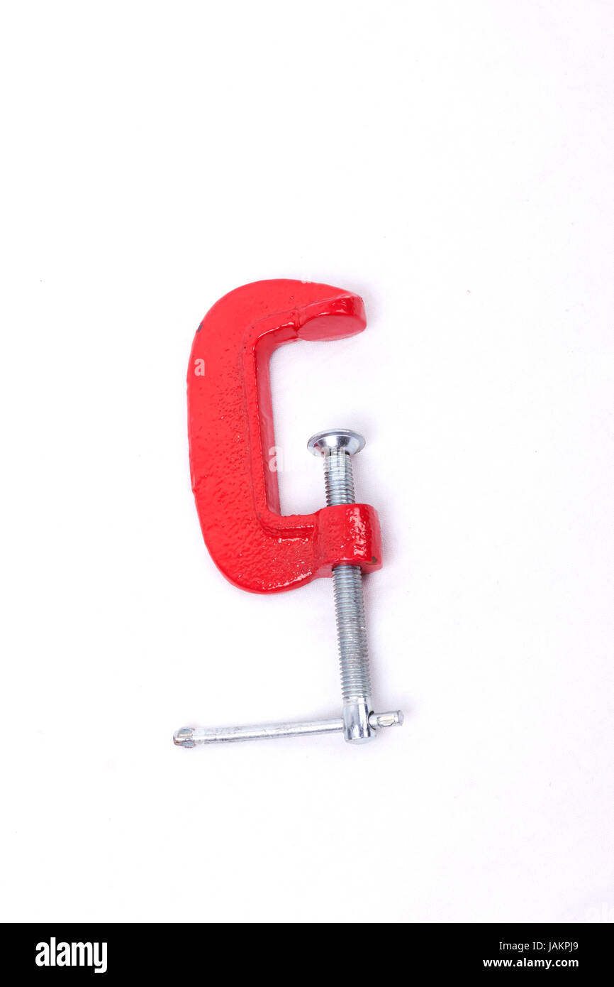 Red clamp isolated on a white background Stock Photo - Alamy