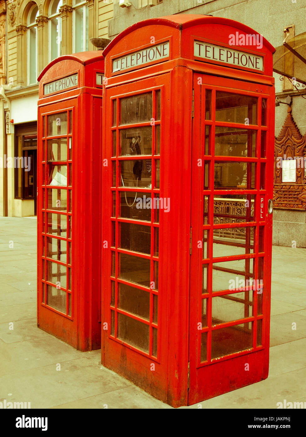 Vintage look Traditional red telephone box in London UK Stock Photo - Alamy