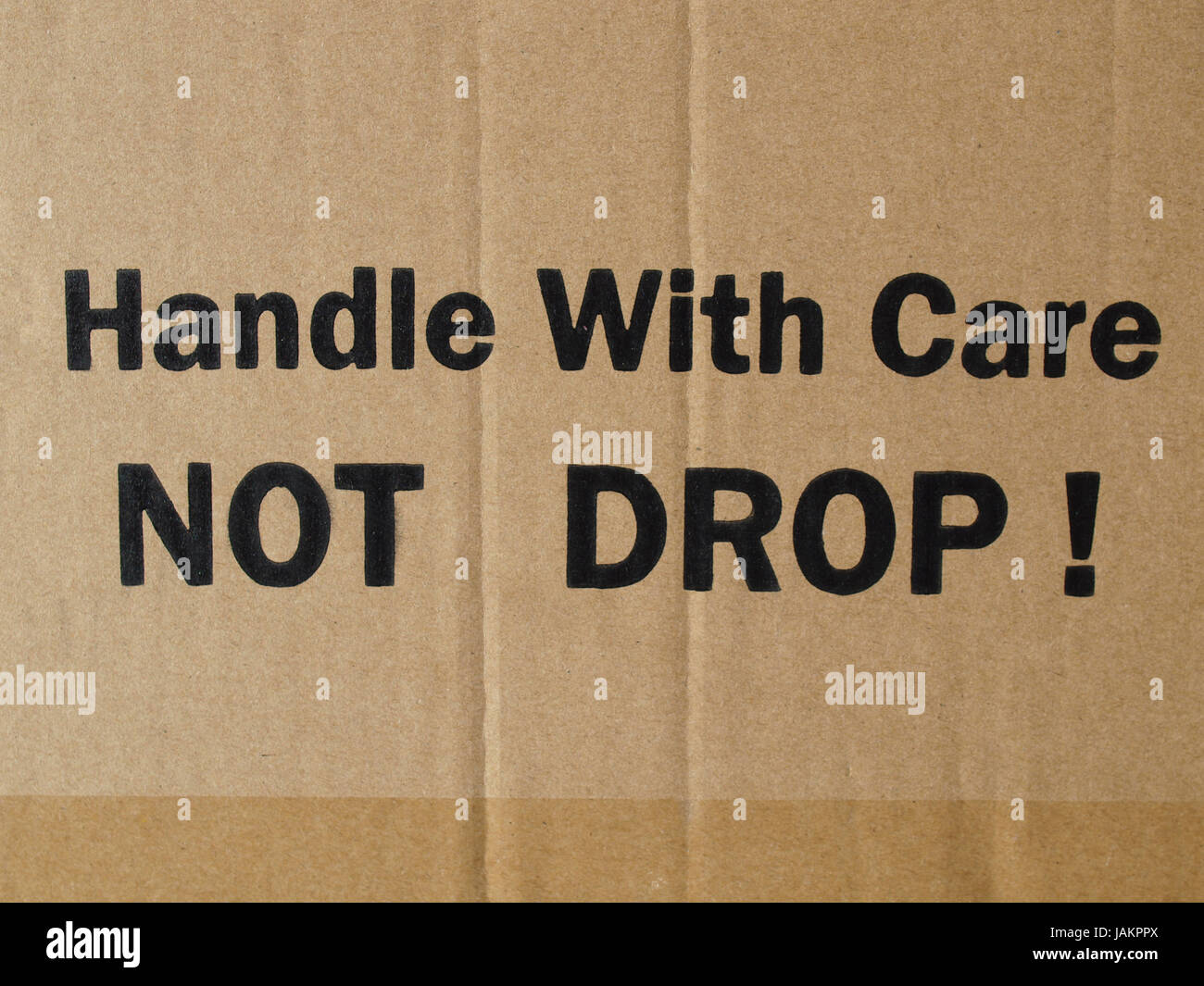 Fragile Handle with Care Do not drop label on a corrugated cardboard box Stock Photo - Alamy