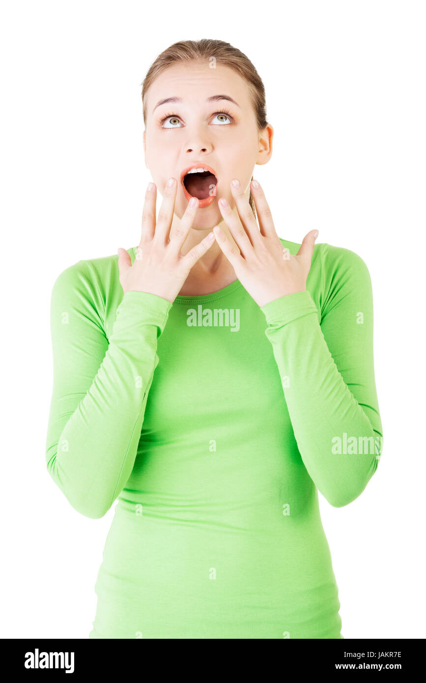 Attractive young woman in a shock. Isolated on white Stock Photo - Alamy