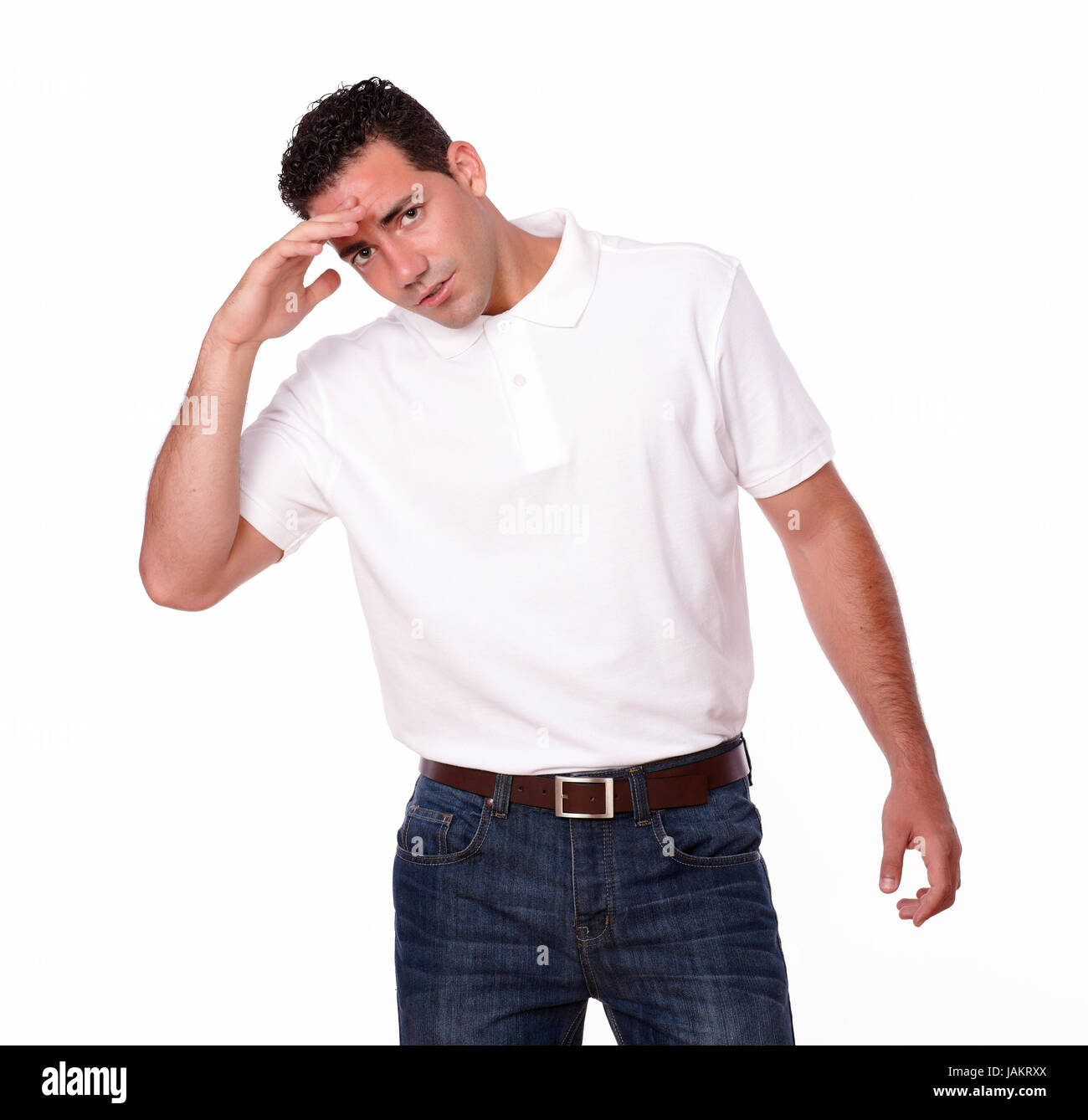 Portrait of a charming hispanic young man standing with headache while ...