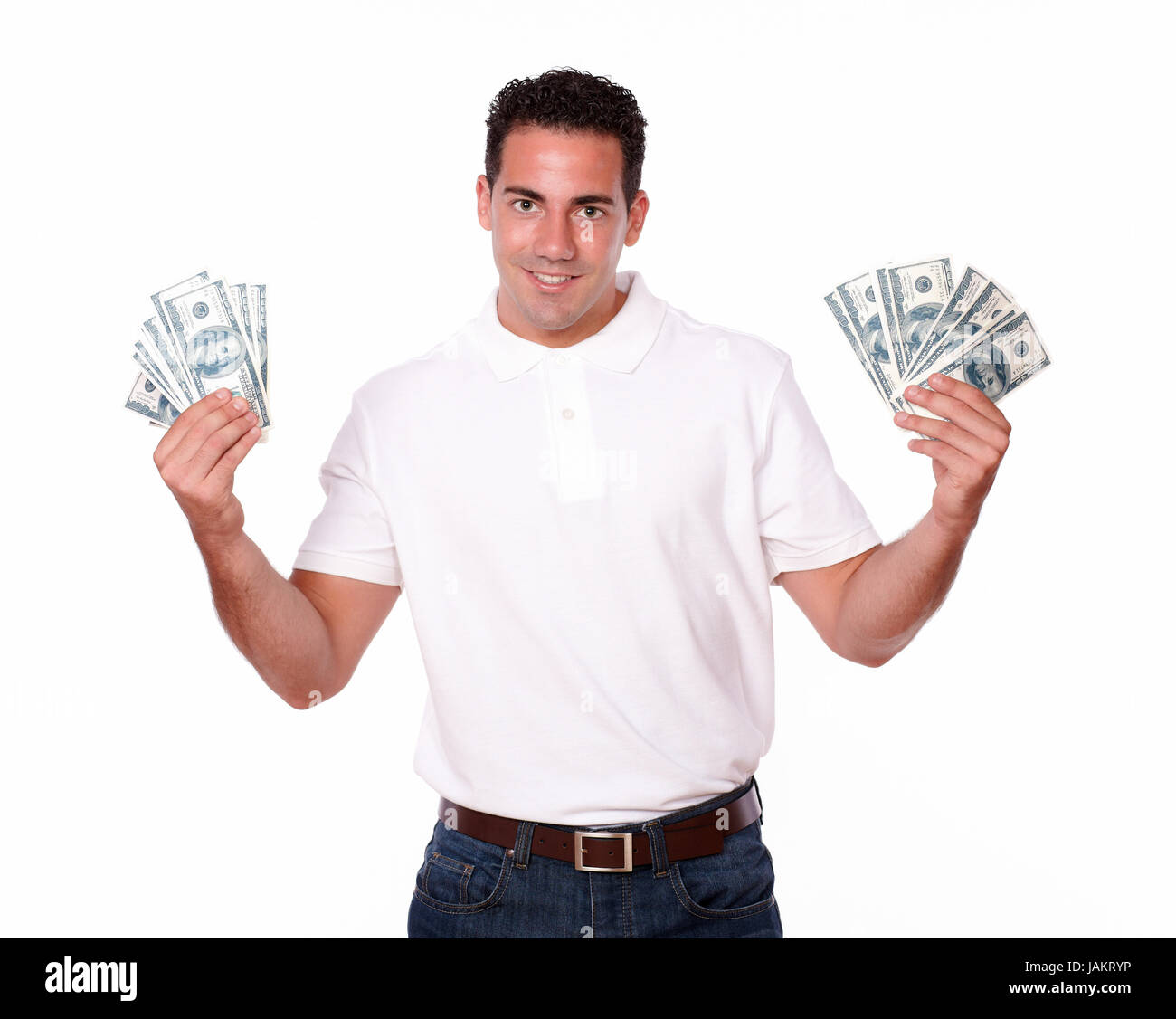 Portrait of a friendly man standing and holding cash money while is ...