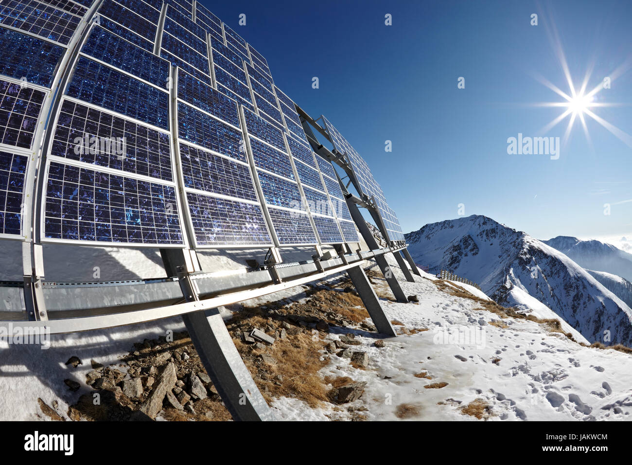 Big cluster of solar panels on a mountain peak Stock Photo - Alamy