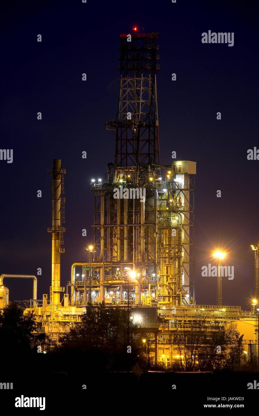 Oil refinery buildings at night Stock Photo - Alamy