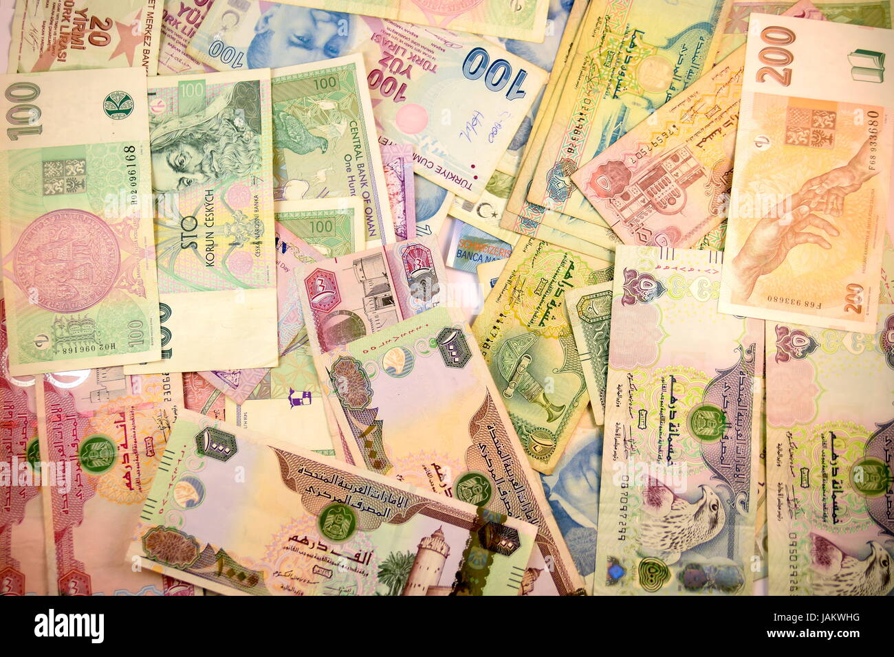 Different currency note and coins from different countries background ...