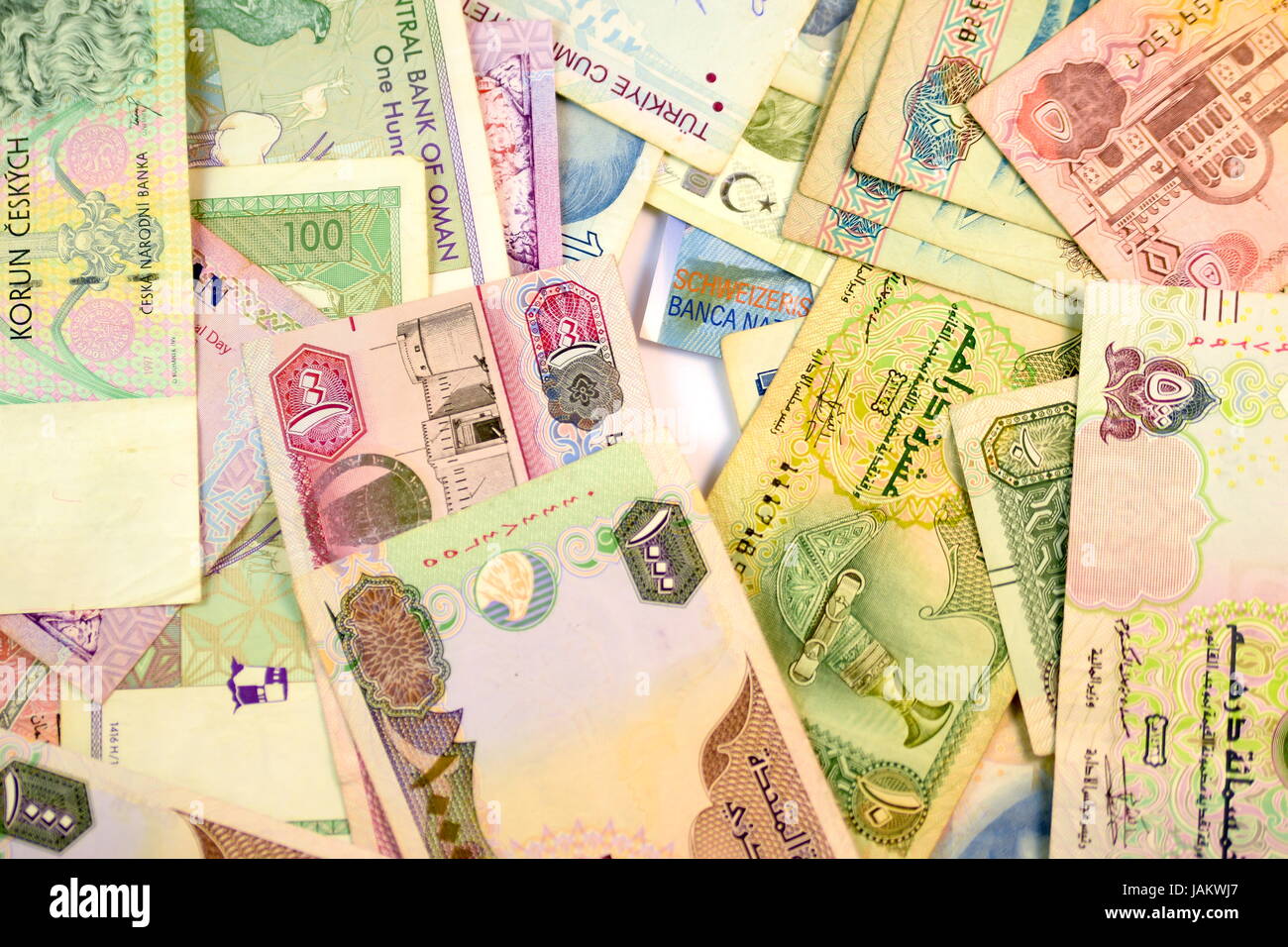 Different currency note and coins from different countries background ...