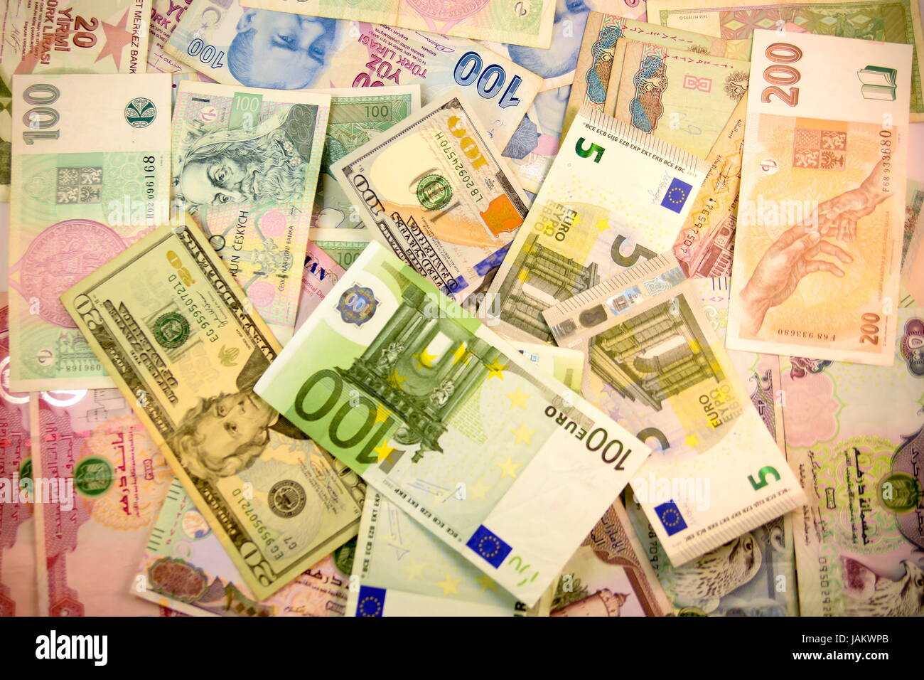 Different currency note and coins from different countries background ...