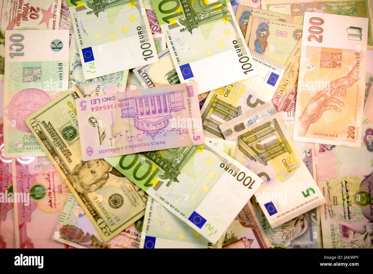 Different currency note and coins from different countries background ...